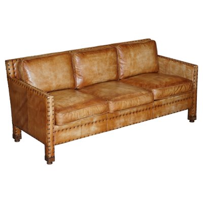 Leather studded sofa store