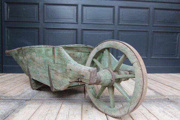 Old fashioned wooden wheelbarrow store