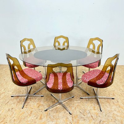 Glass table with acrylic chairs store