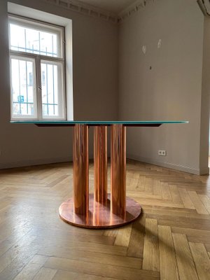 Glass and copper dining table store