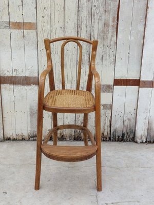 Antique wooden chair with woven seat store