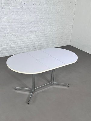 white oval dining table extendable