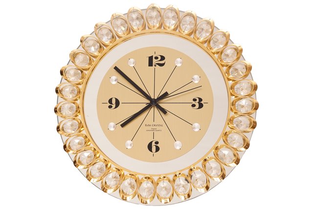 Reloj de pared Hollywood Regency dorado de Junghans, años 80 en venta ...