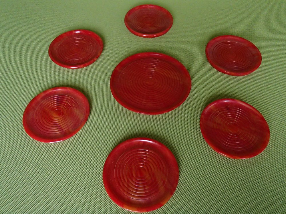Art Deco Red & Yellow Bakelite Coasters, Set of 7 for sale at Pamono