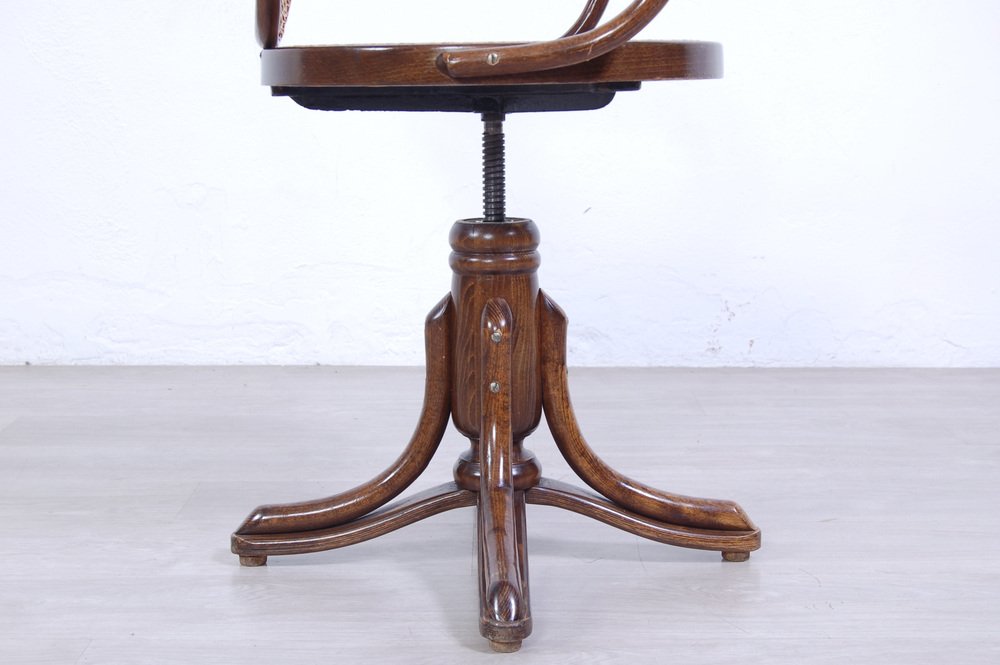 Swivel Wood and Straw Chair, Vienna, 1920s for sale at Pamono