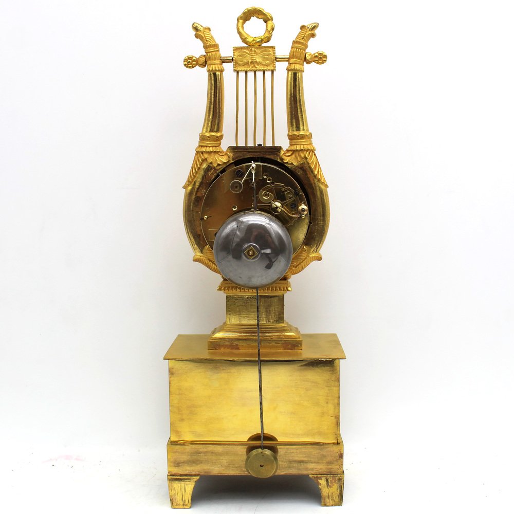 19th Century Empire Gilt Bronze Lira Pendulum Clock for sale at Pamono