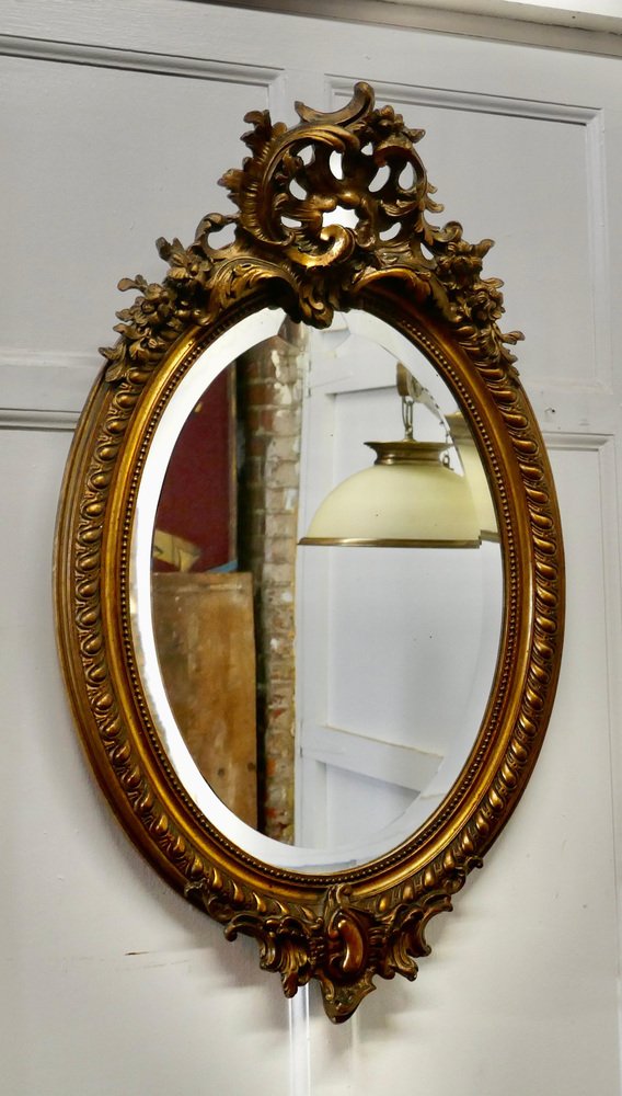 Large French Rococo Oval Gilt Wall Mirror, 1880 for sale at Pamono