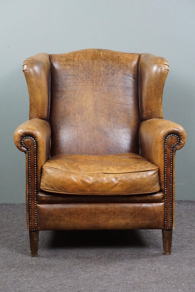 Sheep leather Lounge Chair with Decorative Rivets for sale at Pamono