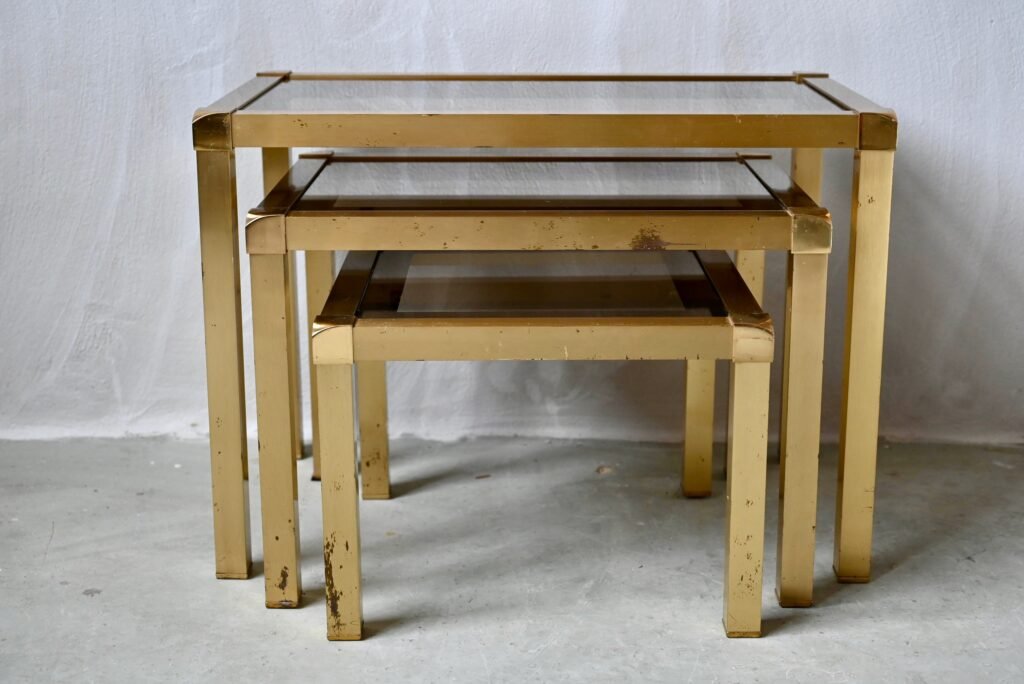 Hollywood Regency Style Nesting Tables or Flying Tables in Gold Metal and Smoked Glass, 1970s ...