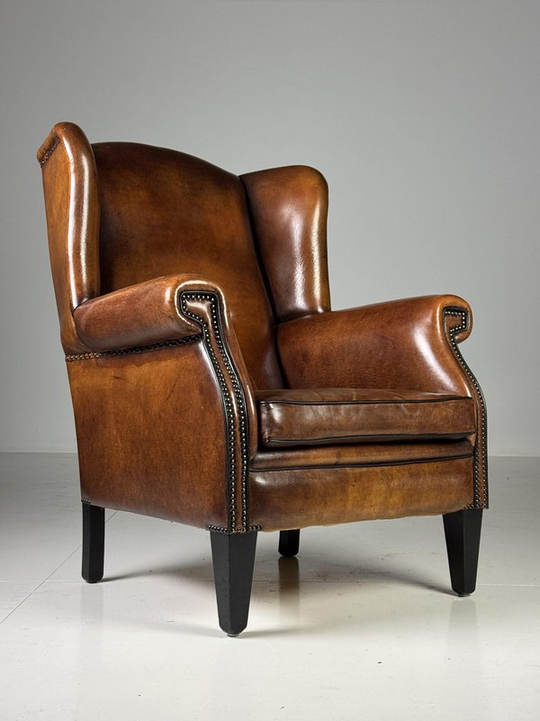 Wingback Sheep's Leather Lounge Chair for sale at Pamono