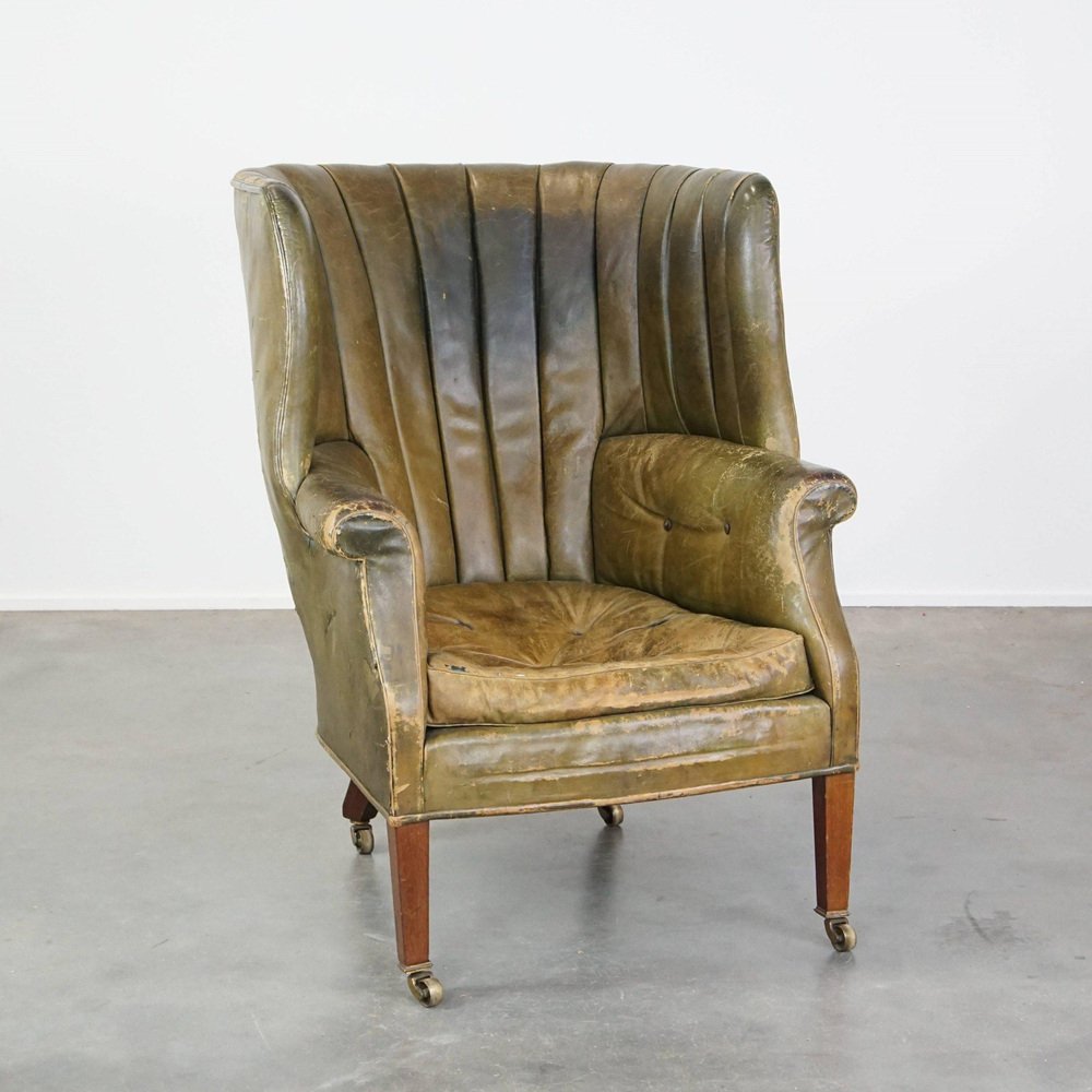 Large Antique Barrel Back Wing Chair in Leather for sale at Pamono