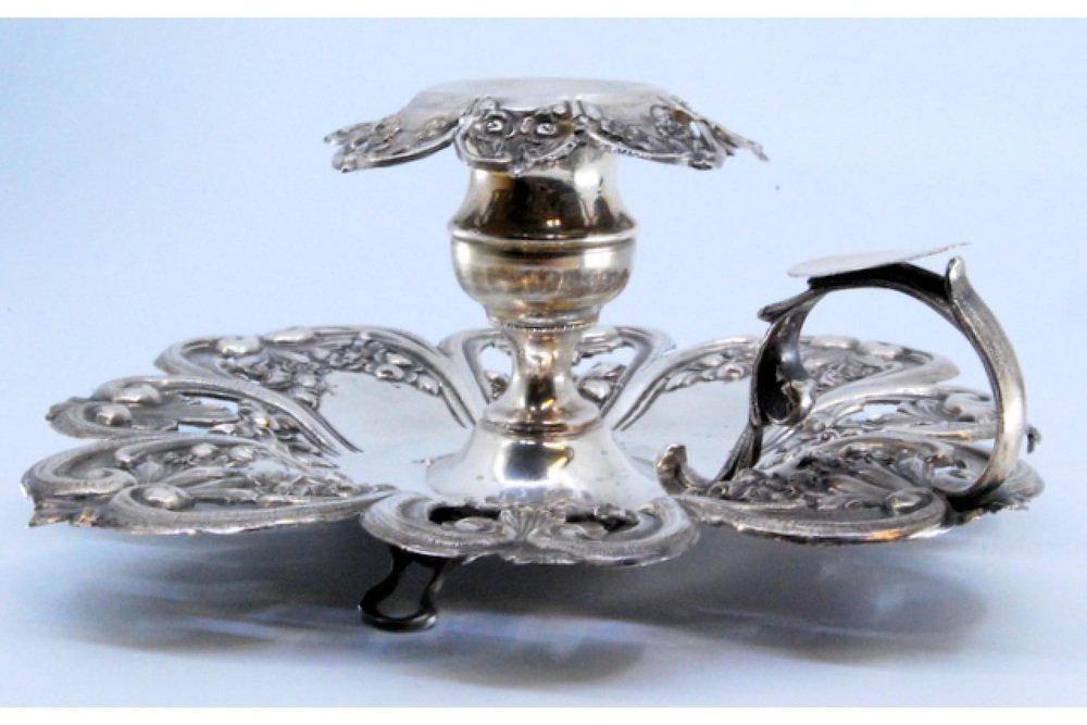 Silver Paddle with Raised Floral Motifs and Resting on Three Feet for ...