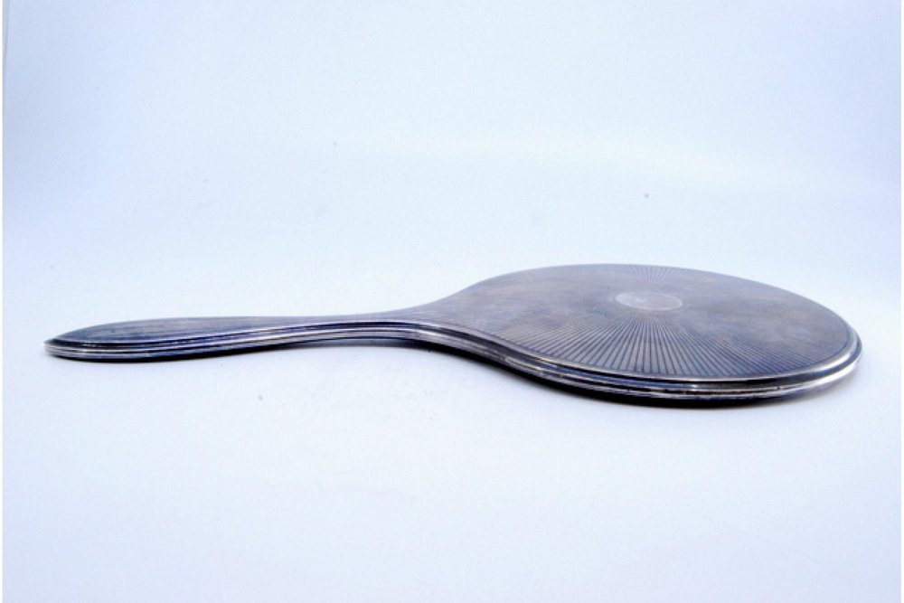 Round Hand Mirror in Plain Silver with Sunbeams Behind It for sale at ...