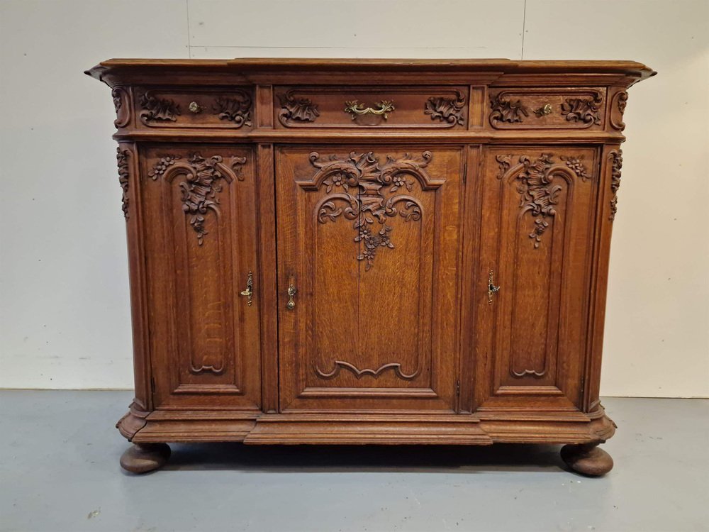 Oak Sideboard with Carvings, 1920s for sale at Pamono